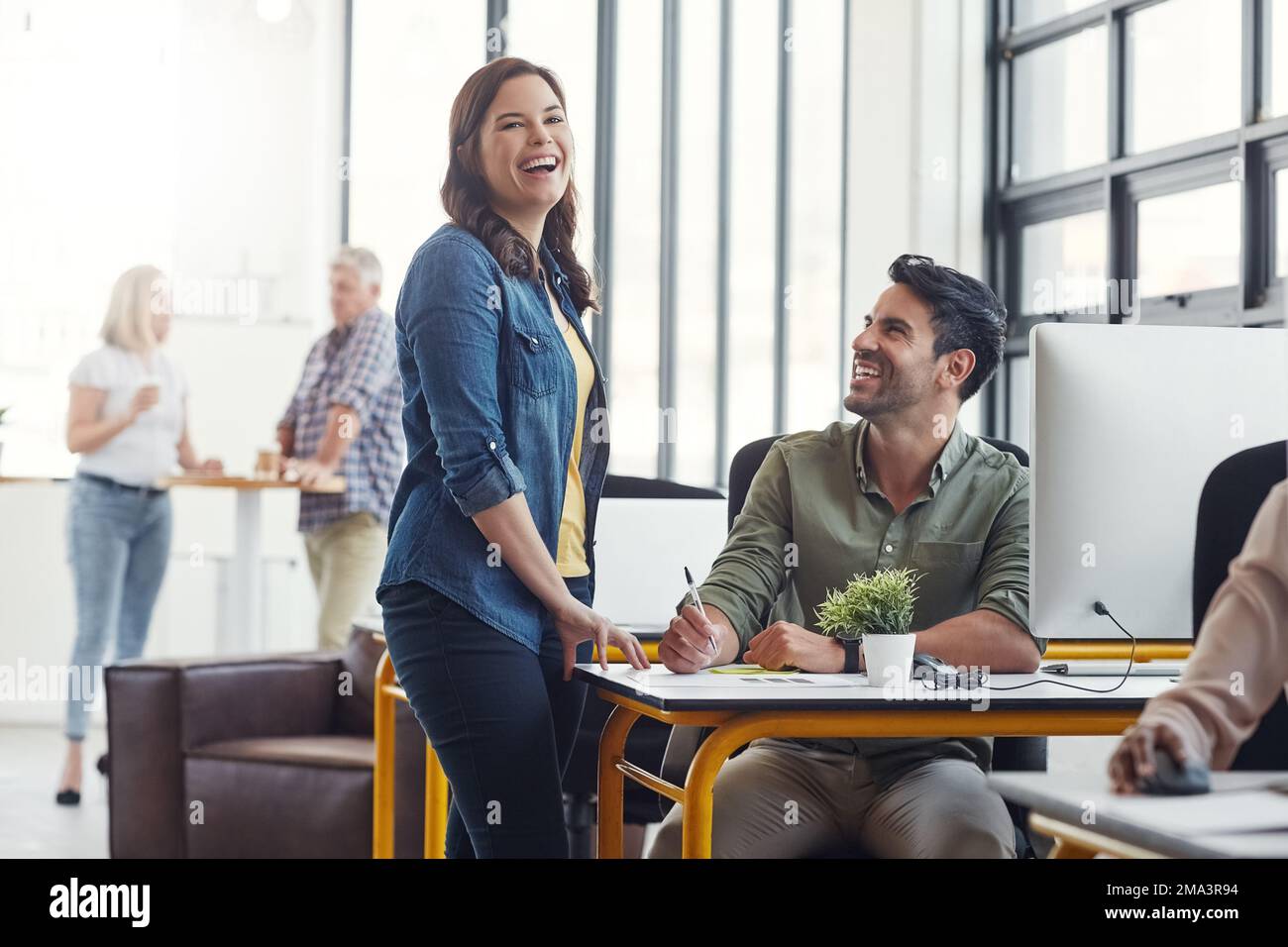 Woman, businessman and funny conversation at startup office, desk and ...