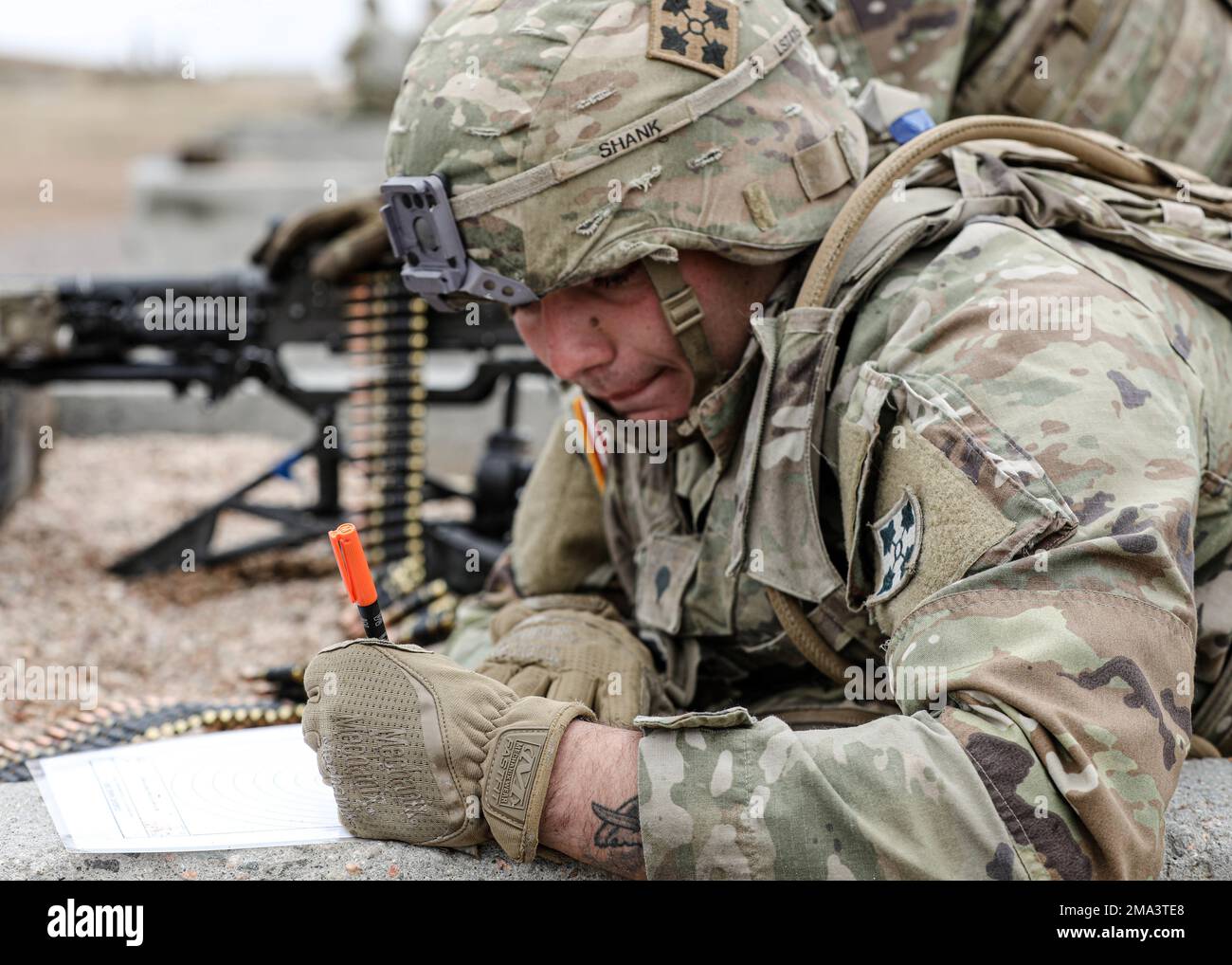 A Soldier assigned to the 4th Infantry Division draws and maps where ...