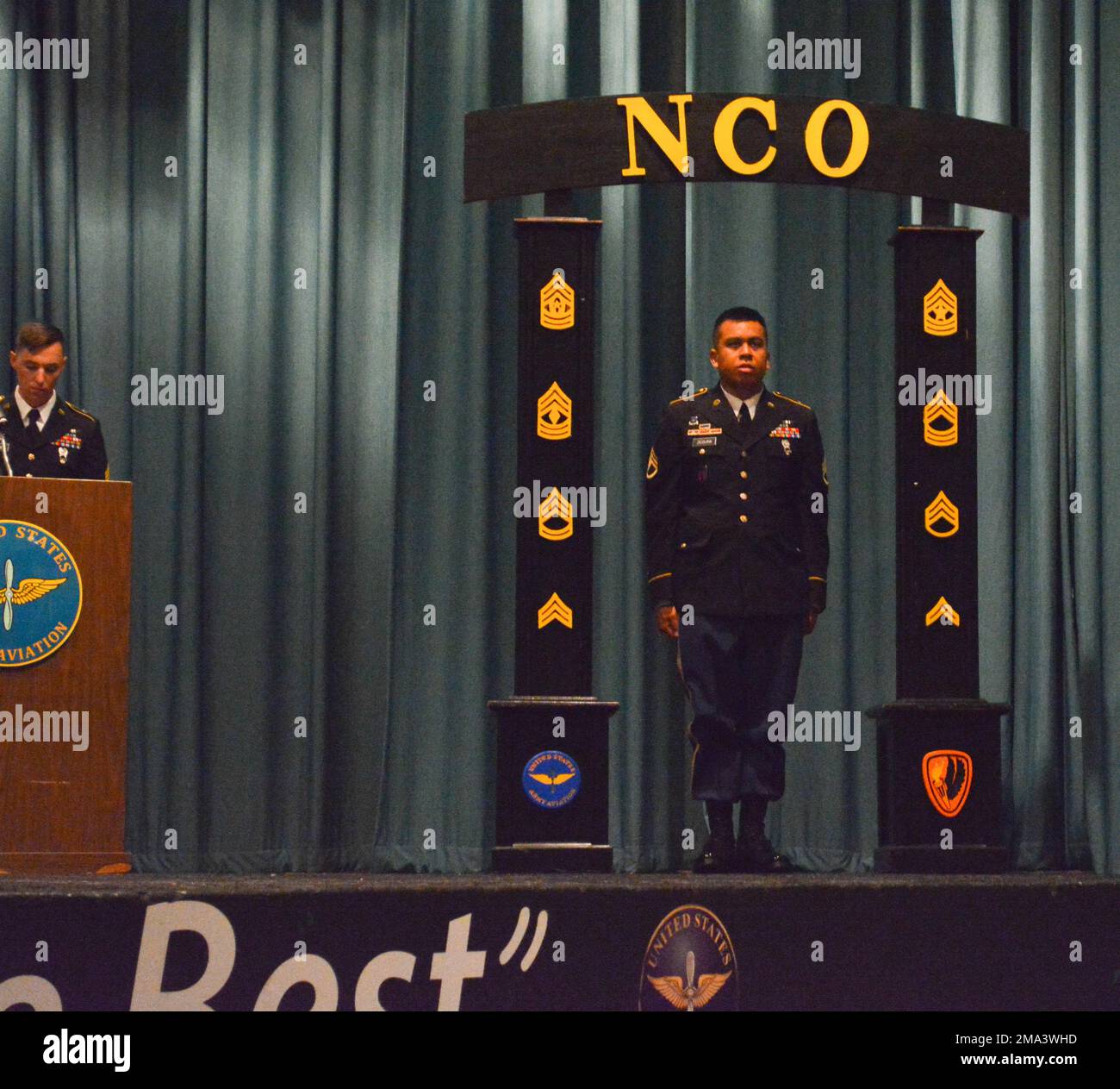 U.S. Army Sgt. Abasi Chong crosses the archway during a Noncommissioned ...