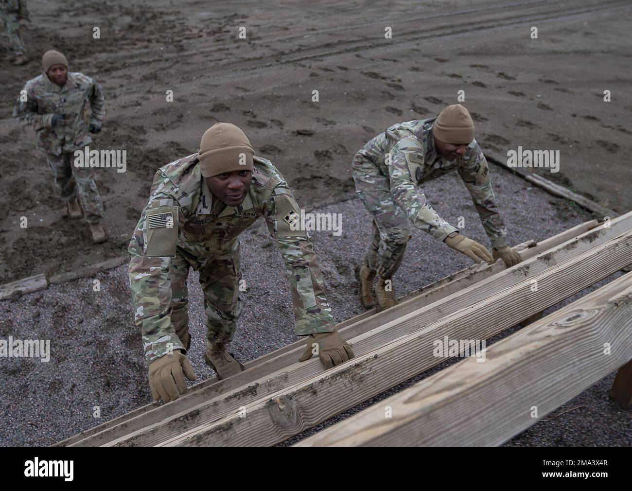 Ivy Leaders assigned to 4th Infantry Division climb up the obstacle ...