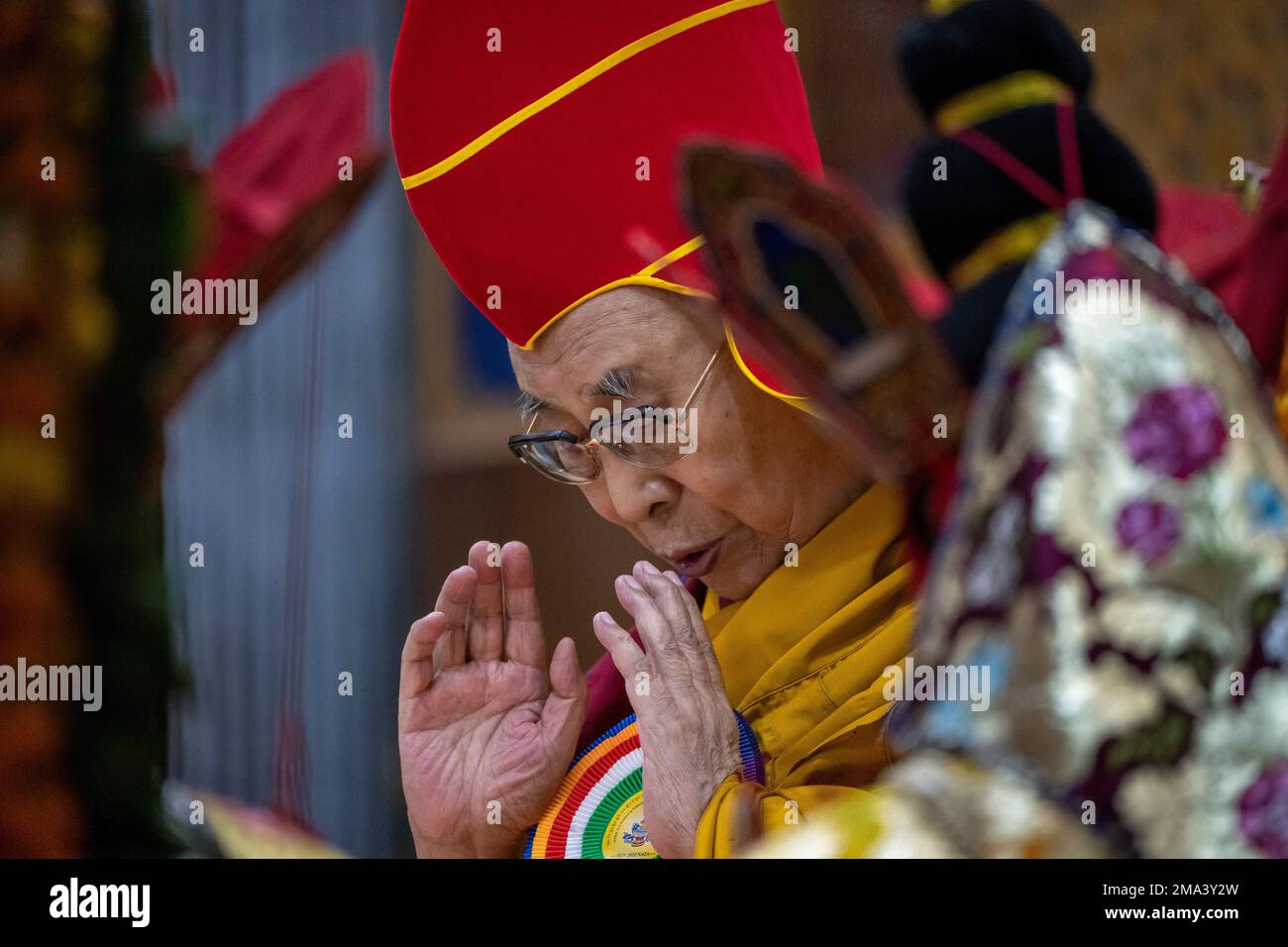 Tibetan spiritual leader the Dalai Lama attends a prayer by devotees ...