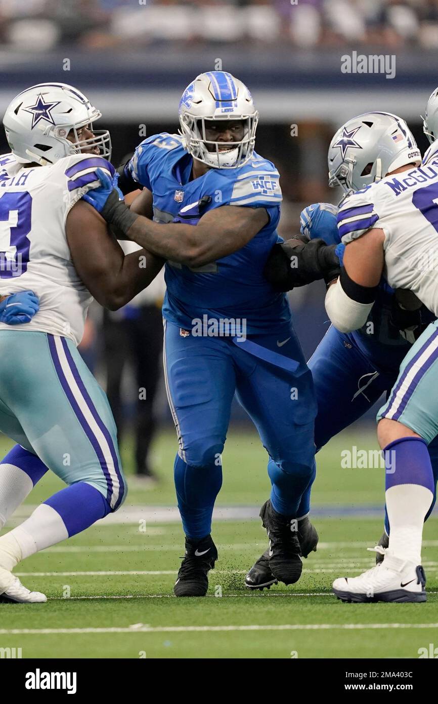 Detroit Lions defensive end Josh Paschal (93) breaks through the line ...