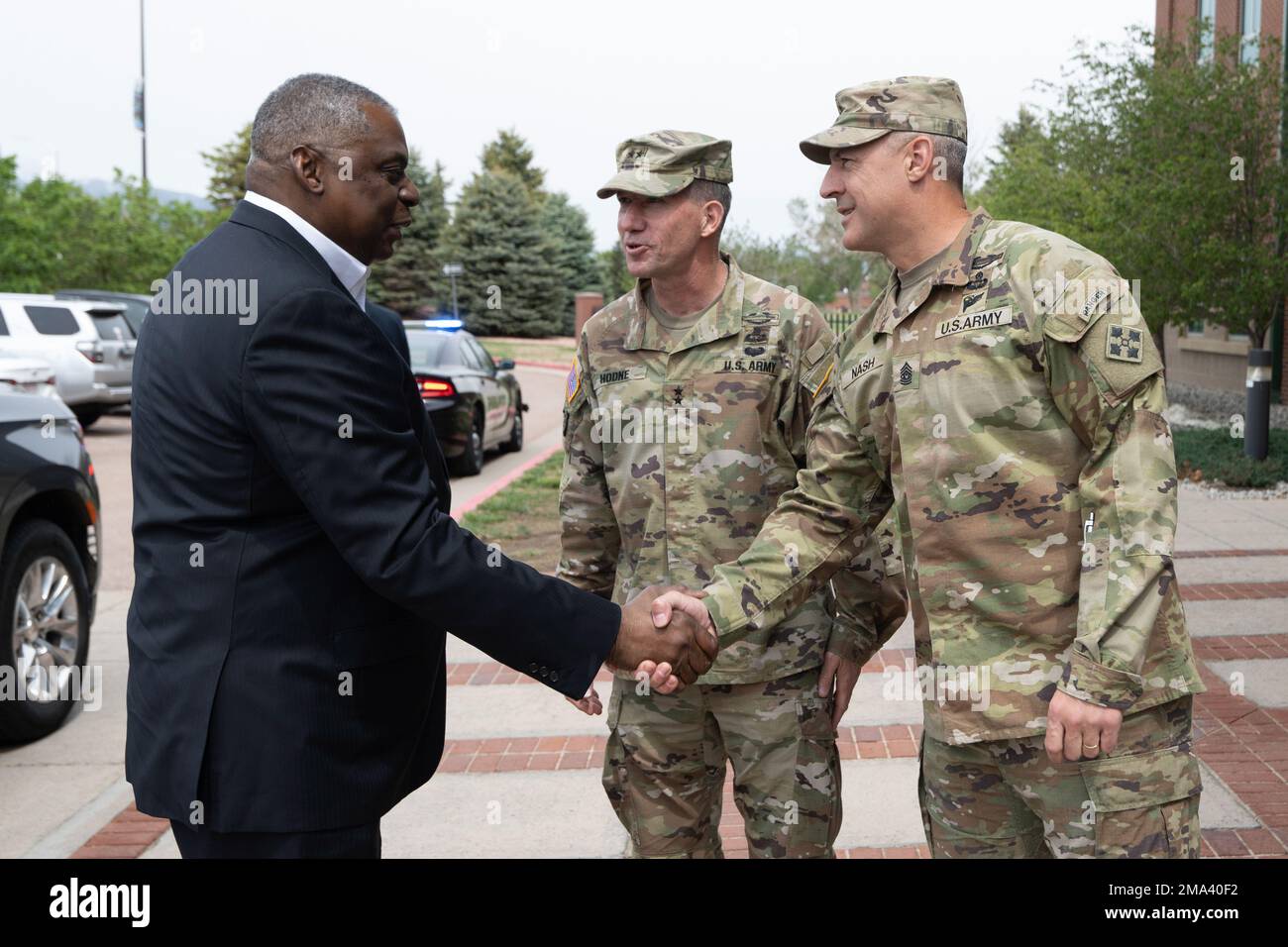 Secretary of Defense Lloyd J. Austin III is greeted by U.S. Army Maj ...