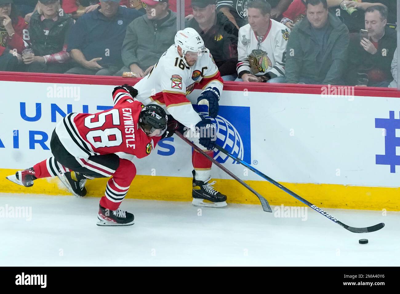 Chicago Blackhawks' MacKenzie Entwistle (58) battles Florida Panthers ...