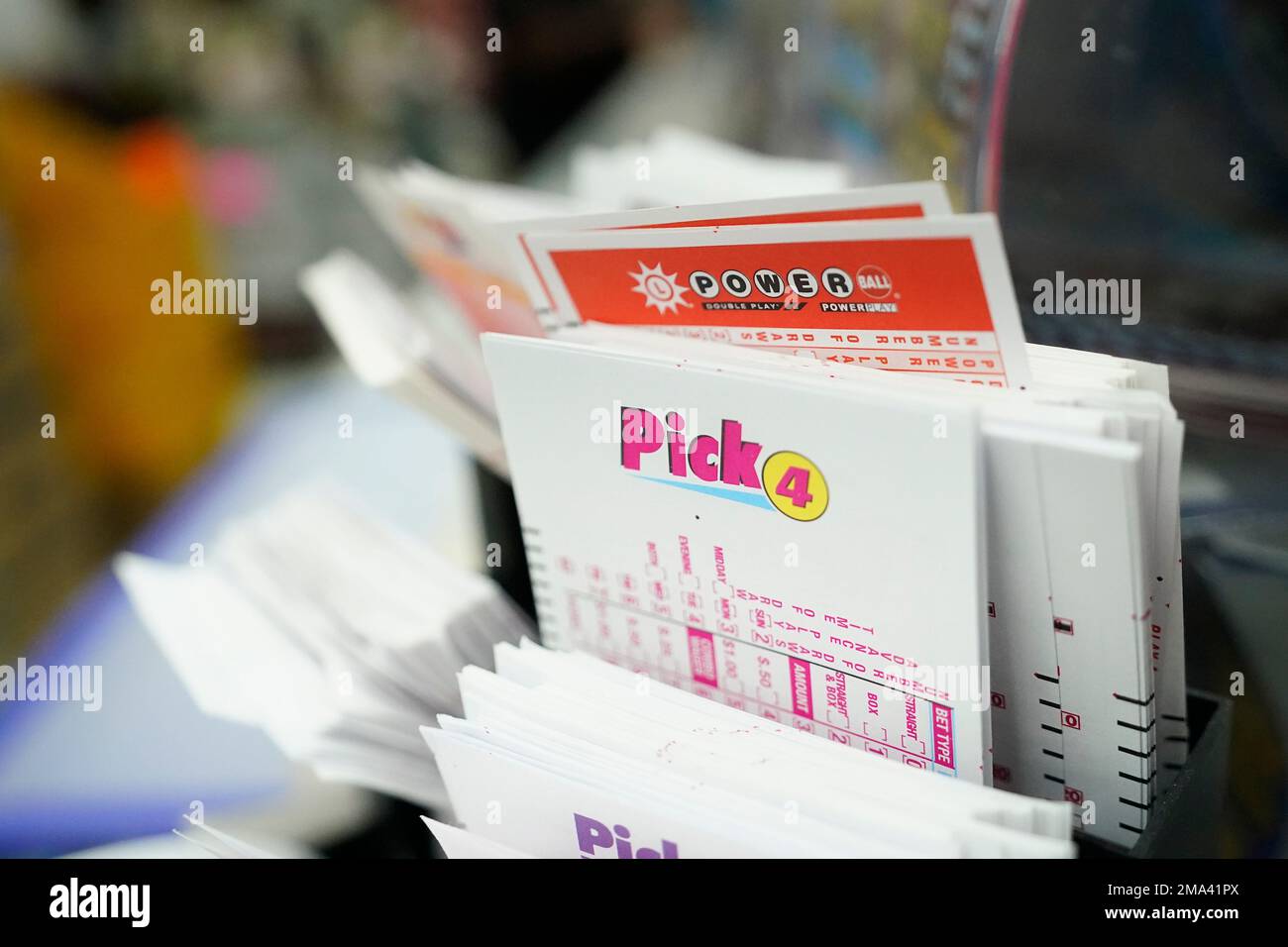 Lottery play stubs, including one for the Powerball, are seen on ...