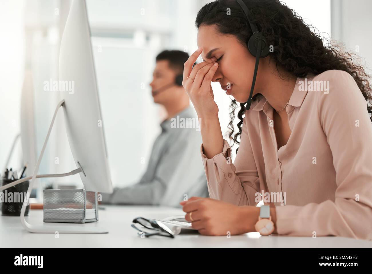 She needs to rest. a young female call center agent suffering from a ...