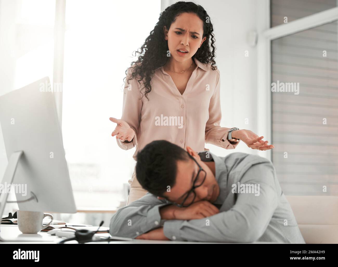 Why is he sleeping. a young male call center agent taking a nap at work ...