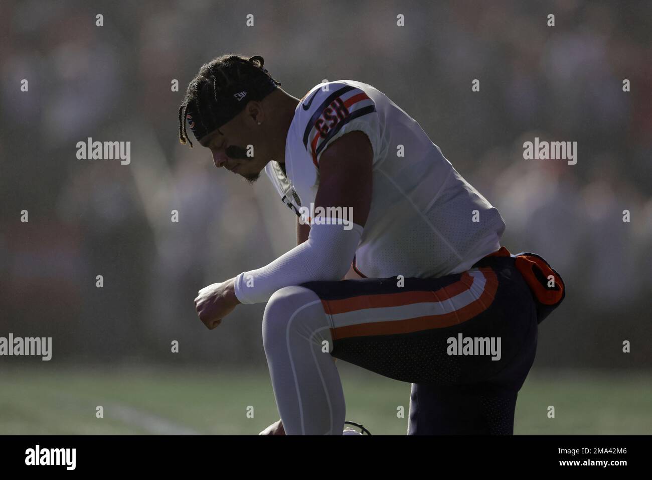 Chicago Bears quarterback Justin Fields (1) kneels prior to an NFL ...
