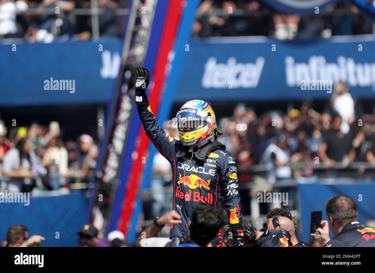 Mexican Formula One Red Bull driver Sergio "Checo" Perez waves at fans after an exhibition race ...