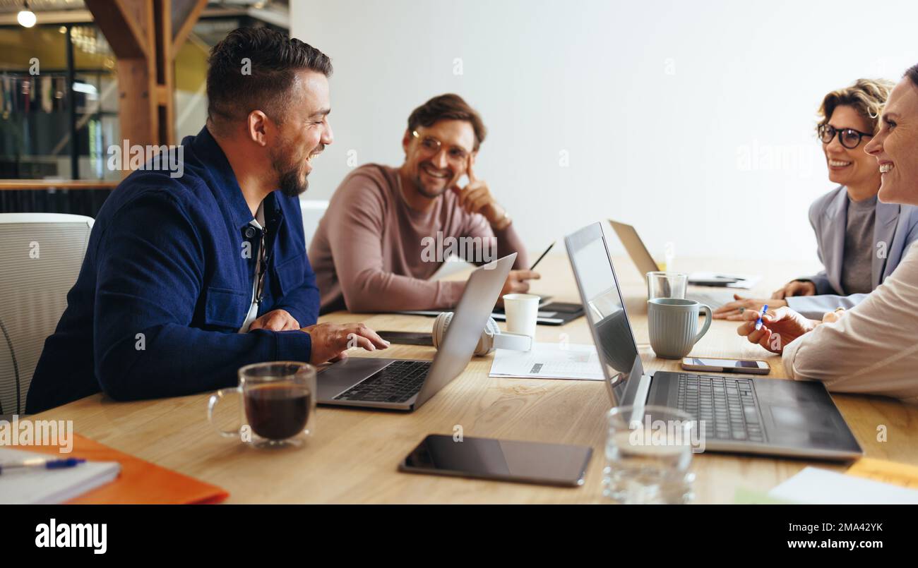 Advertising professionals having a meeting in a boardroom. Group of ...