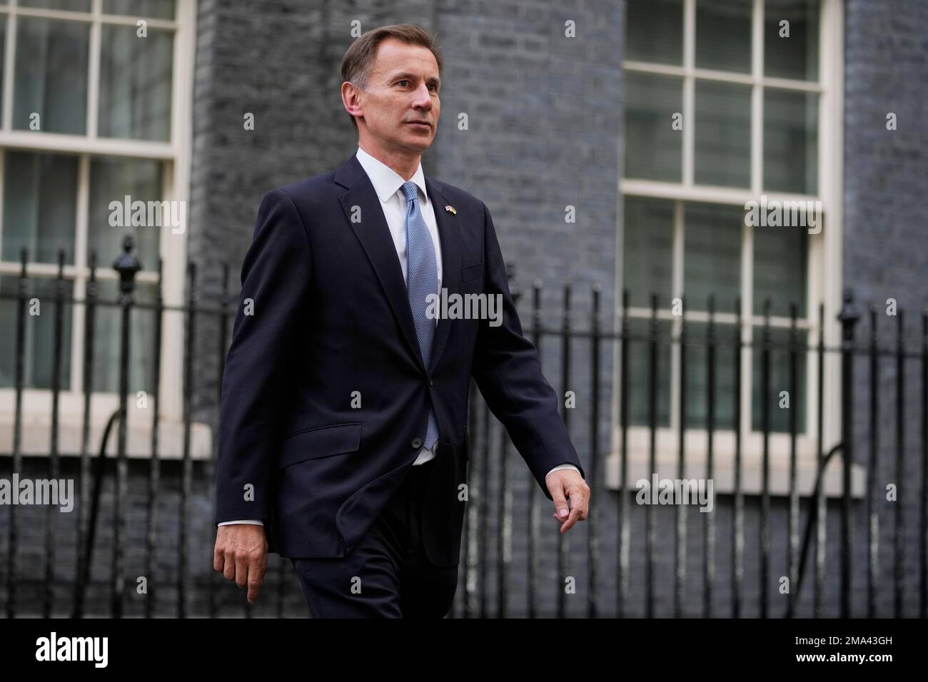 British Chancellor of the Exchequer Jeremy Hunt walks outside 10 ...