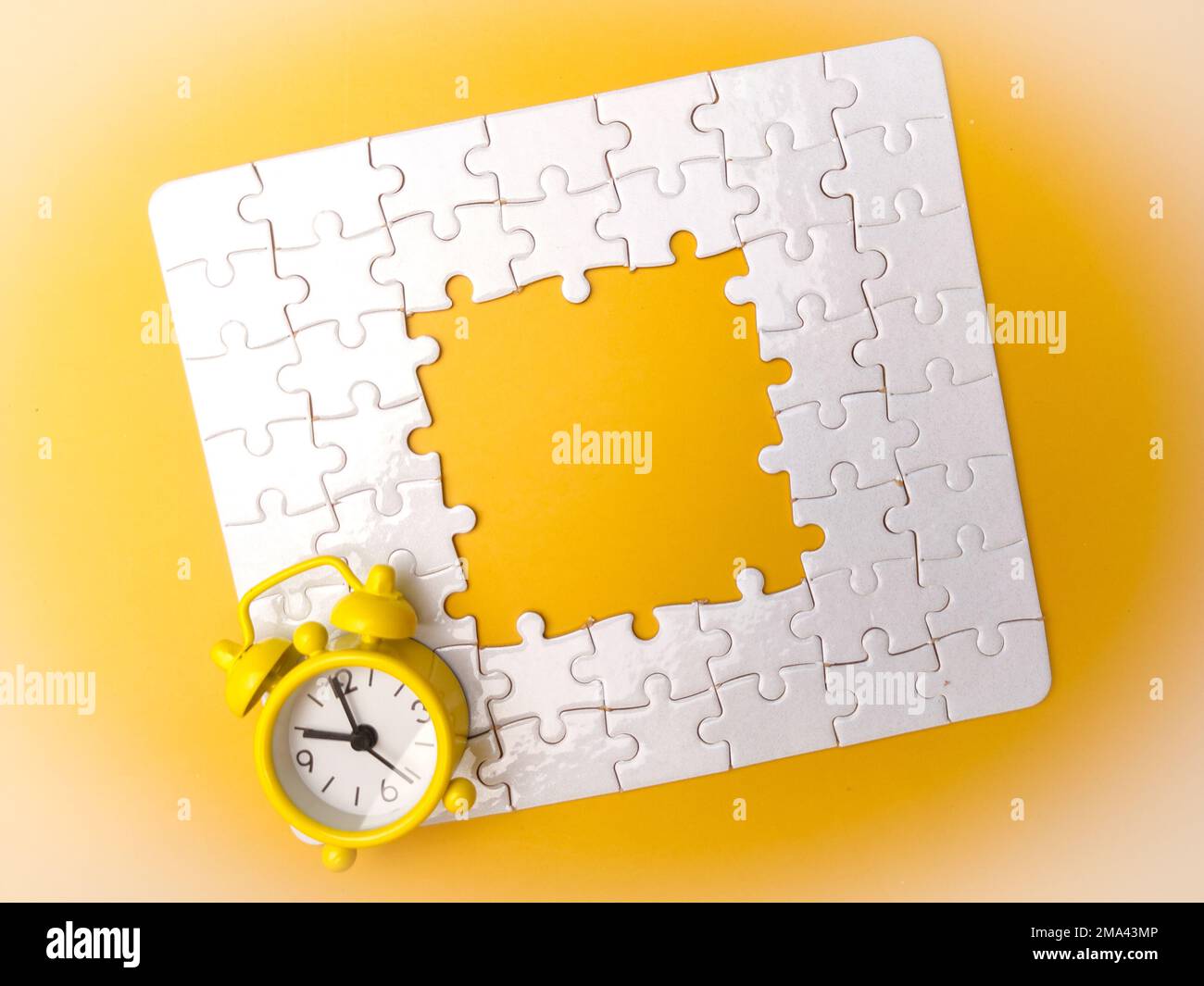 Jigsaw puzzle piece clock hi-res stock photography and images - Alamy