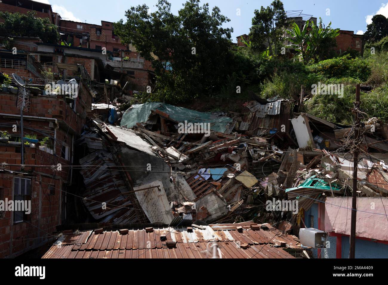 Collapsed homes lay in the 23 de Enero neighborhood in Caracas ...
