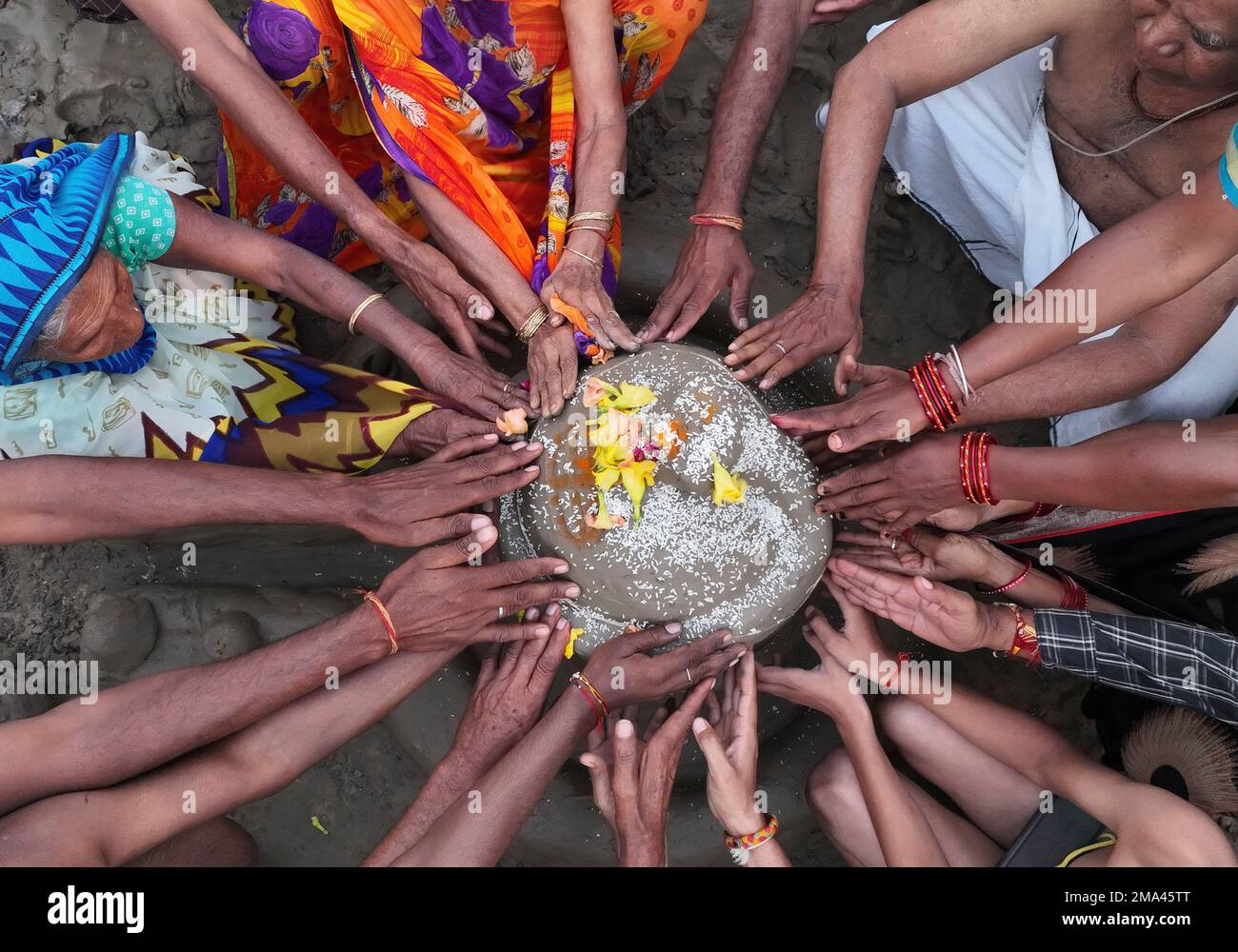 Hindu devotees perform rituals in the Sangam, the confluence of the ...