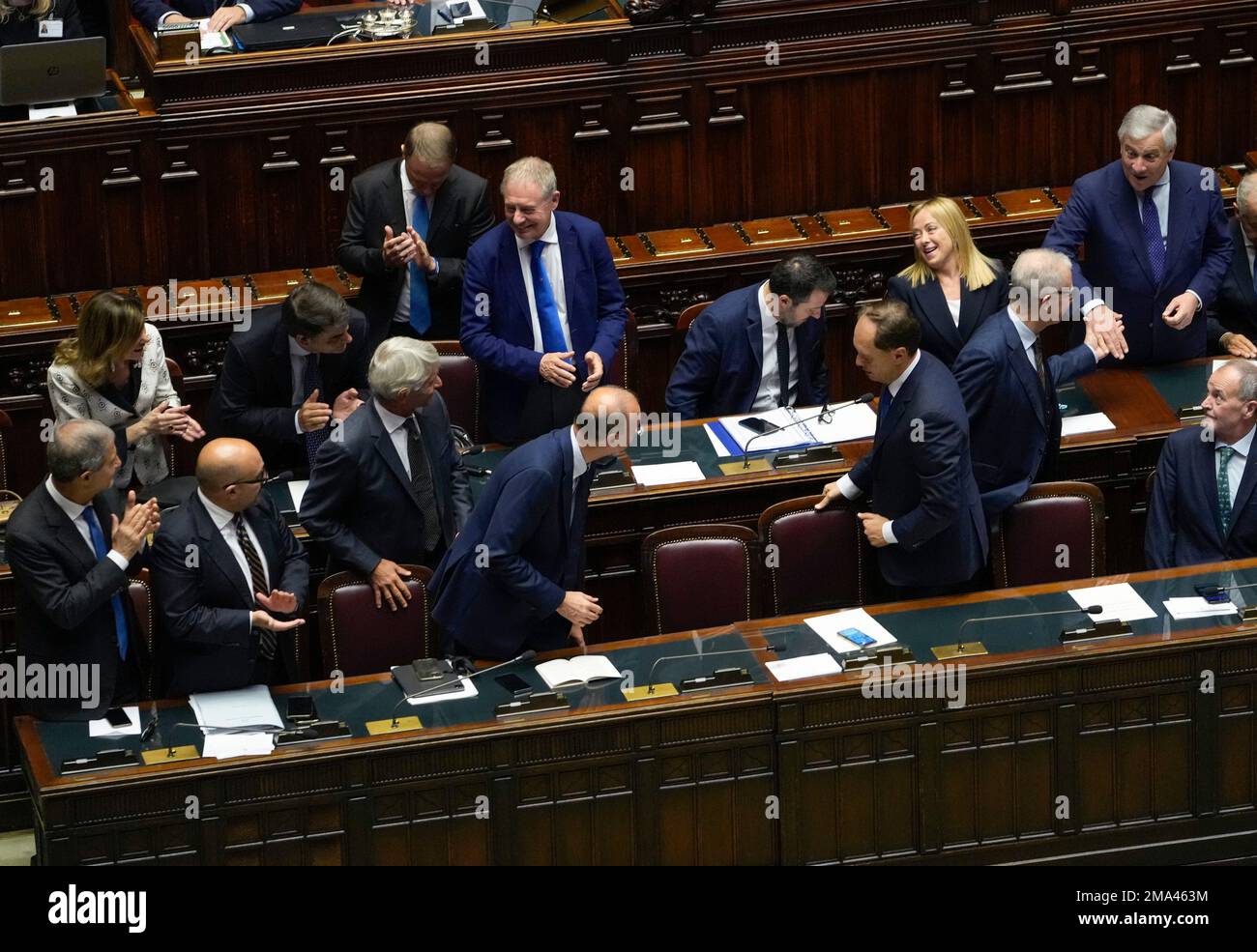 Italian Premier Giorgia Meloni, at right, arrives to address the lower ...