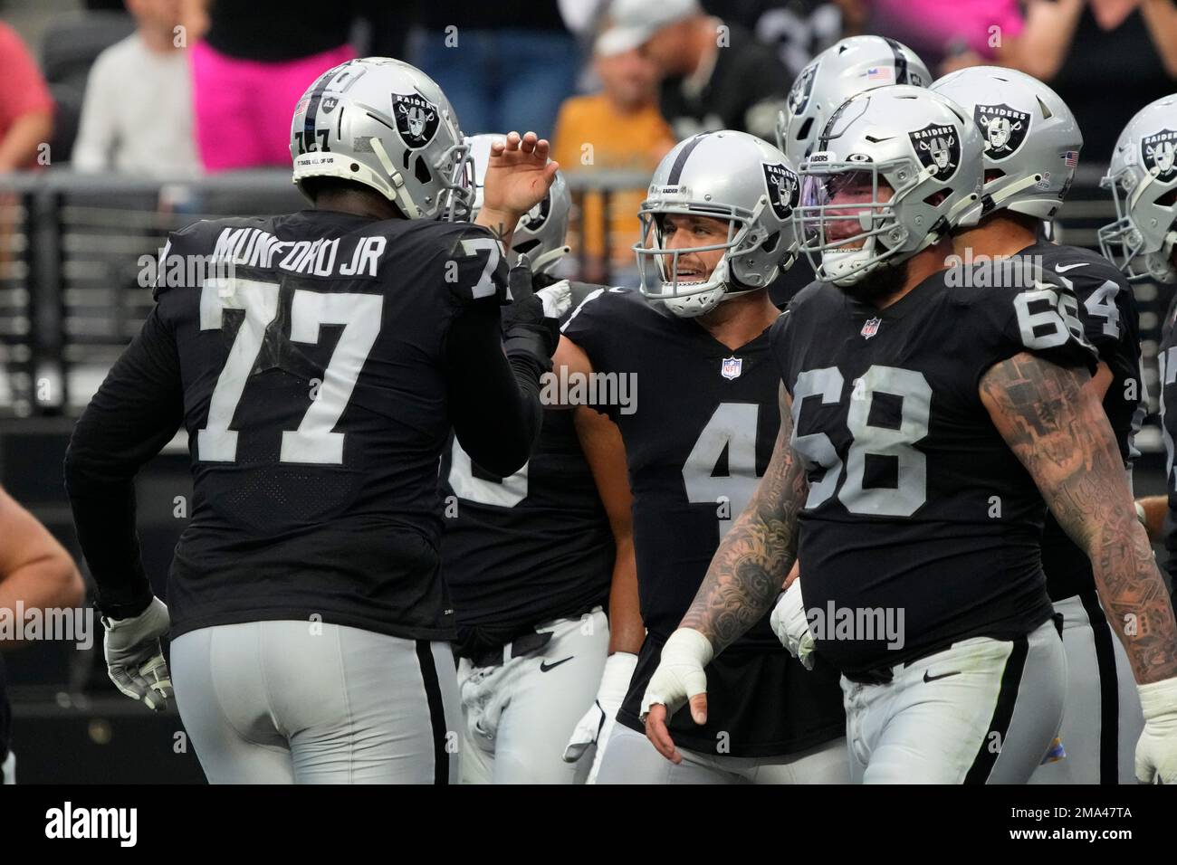 Las Vegas Raiders quarterback Derek Carr (4) talks to his team during ...