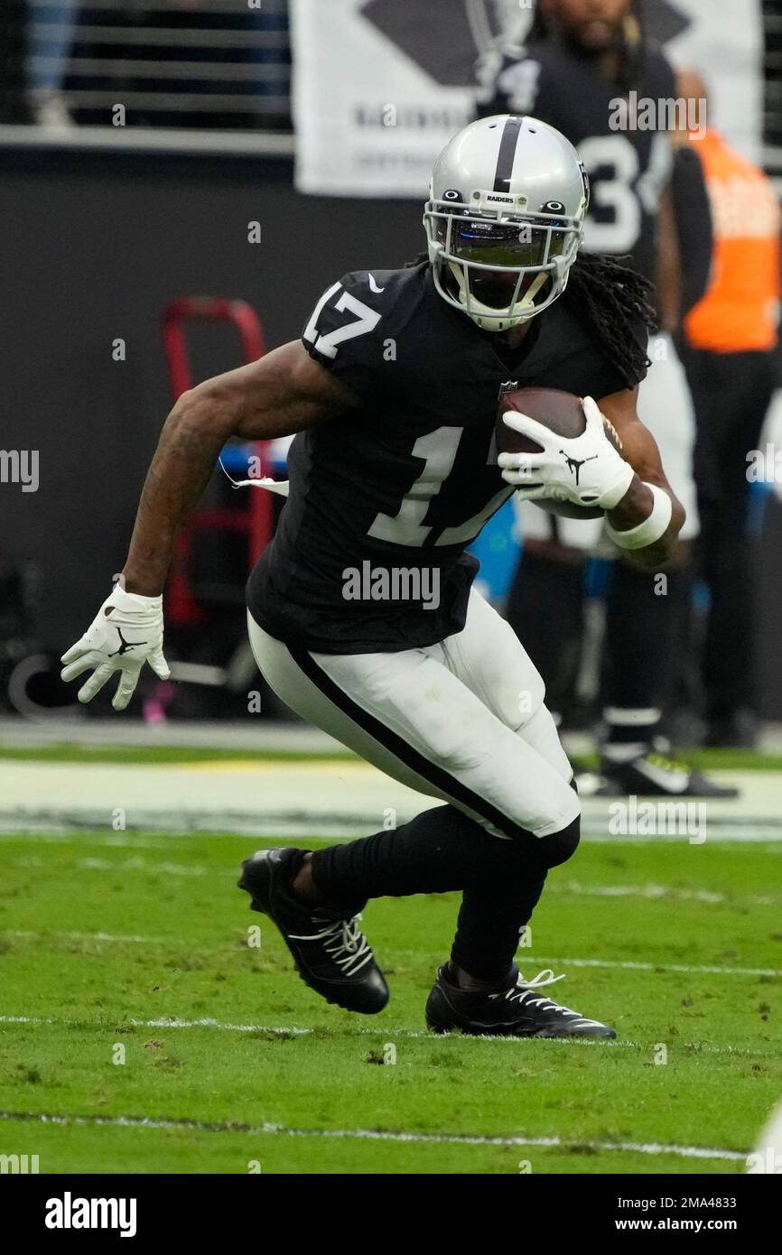 Las Vegas Raiders wide receiver Davante Adams (17) runs the ball during ...