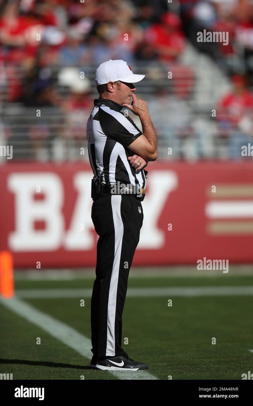 Referee Alex Kemp (55) looks downfield during an NFL football game ...