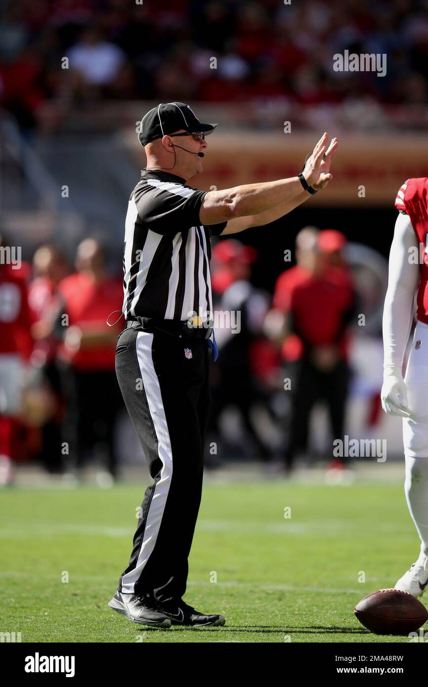 Umpire Mike Morton (89) instructs during an NFL football game between ...
