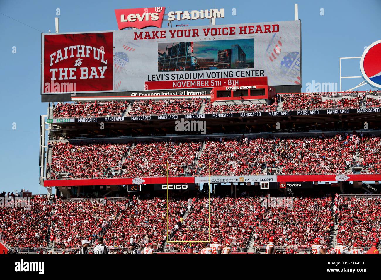 A voting sign is displayed during an NFL football game between the San ...