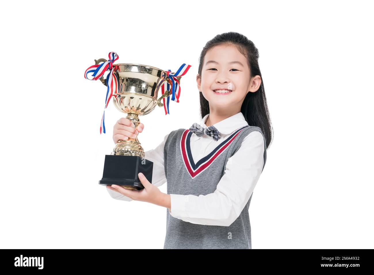 Happy primary school students holding a trophy Stock Photo - Alamy
