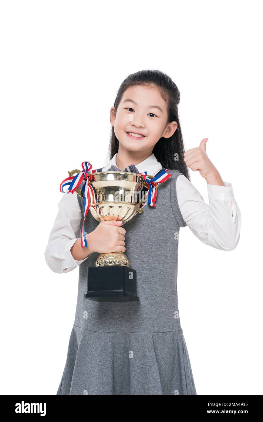 Happy primary school students holding a trophy Stock Photo - Alamy