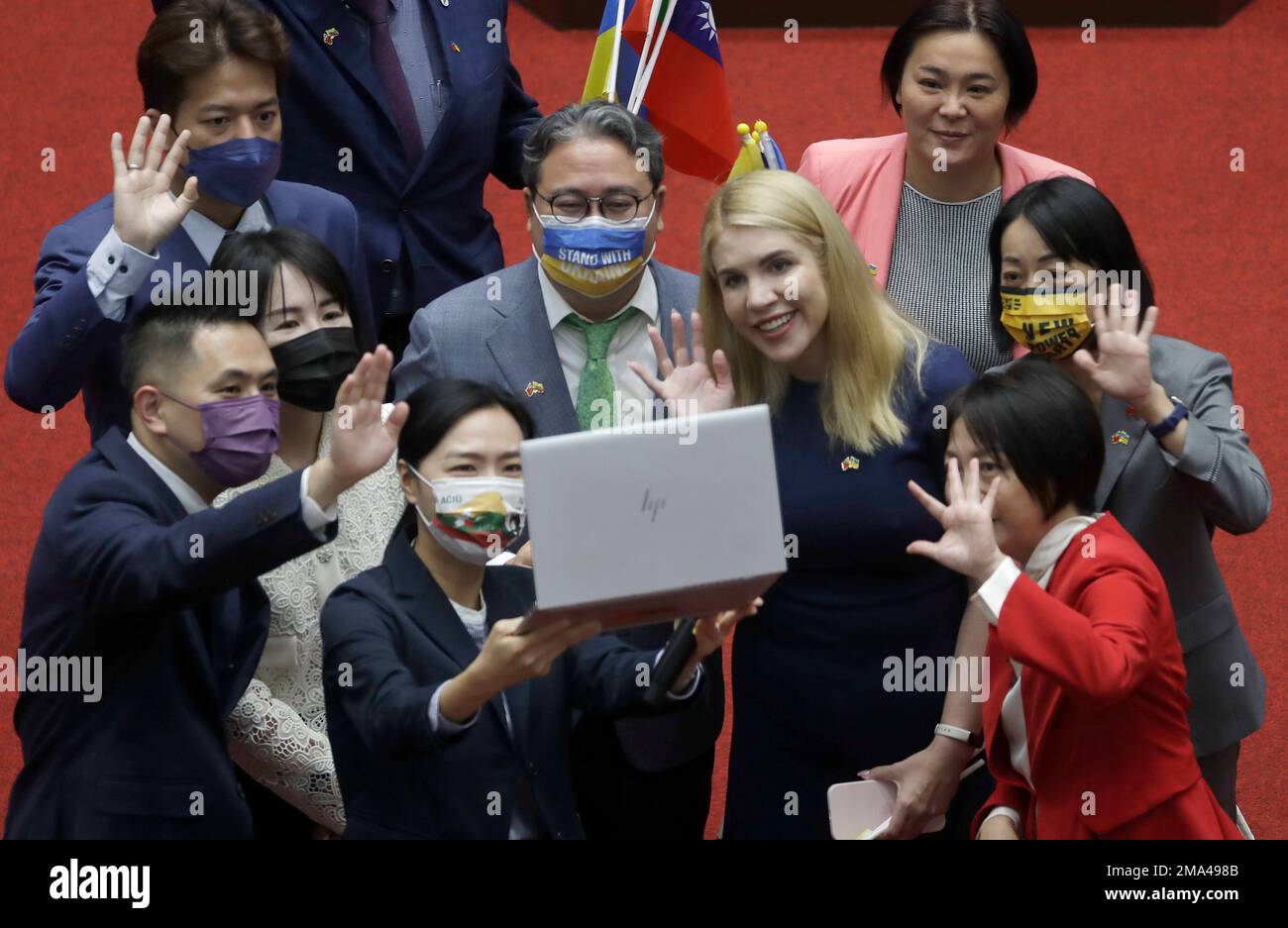 Ukrainian lawmaker Kira Rudik , center right, streams live to Ukraine ...