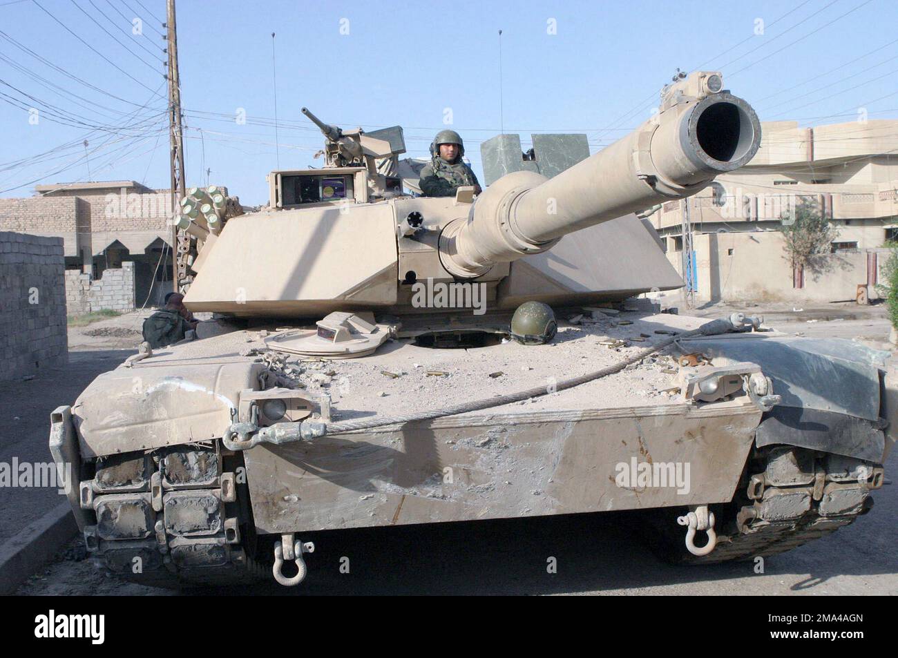 A US Marine Corps (USMC) Marine cautiously checks the surroundings ...