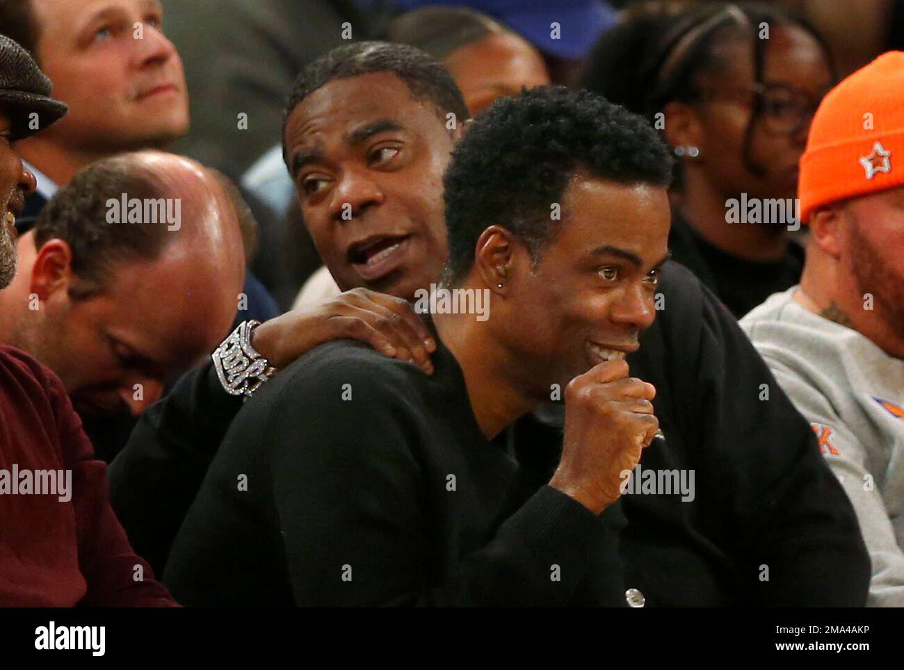 Comedians Tracy Morgan, left, and Chris Rock sit court-side as the New ...