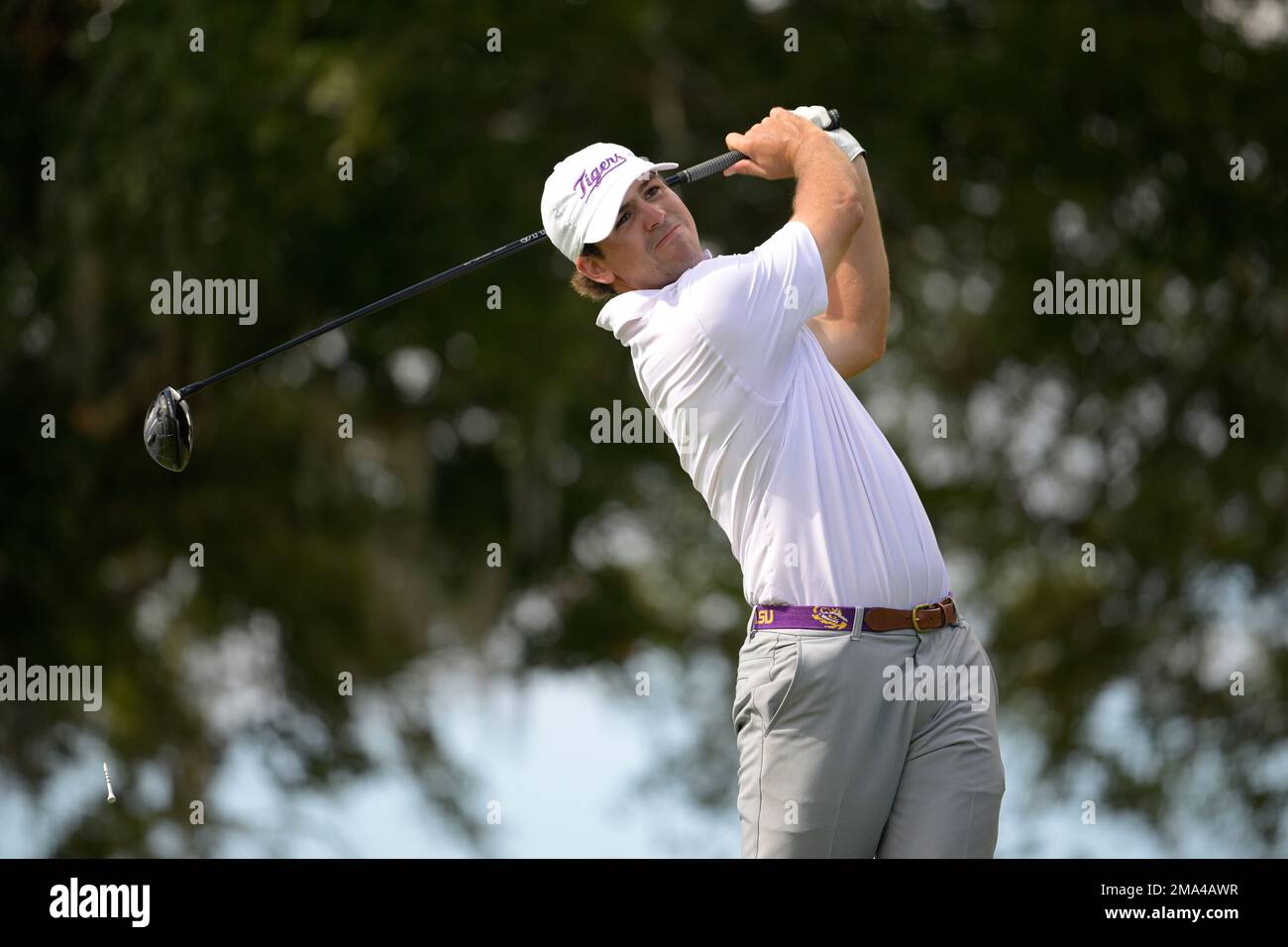 Connor Gaunt, of LSU, watches his tee shot on the 18th hole during an ...