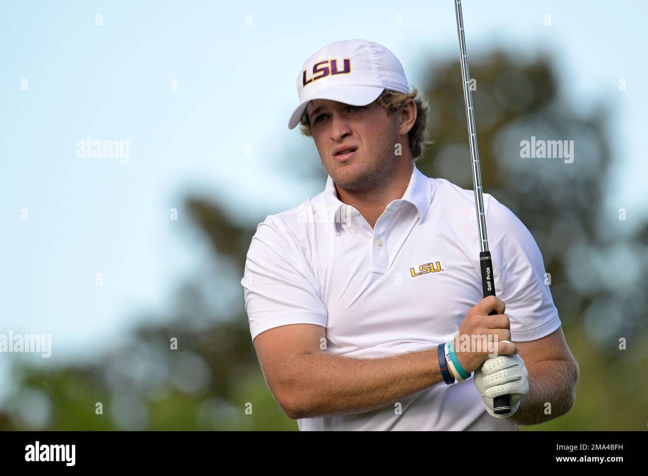 Garrett Barber, of LSU, watches his tee shot on the second hole during ...