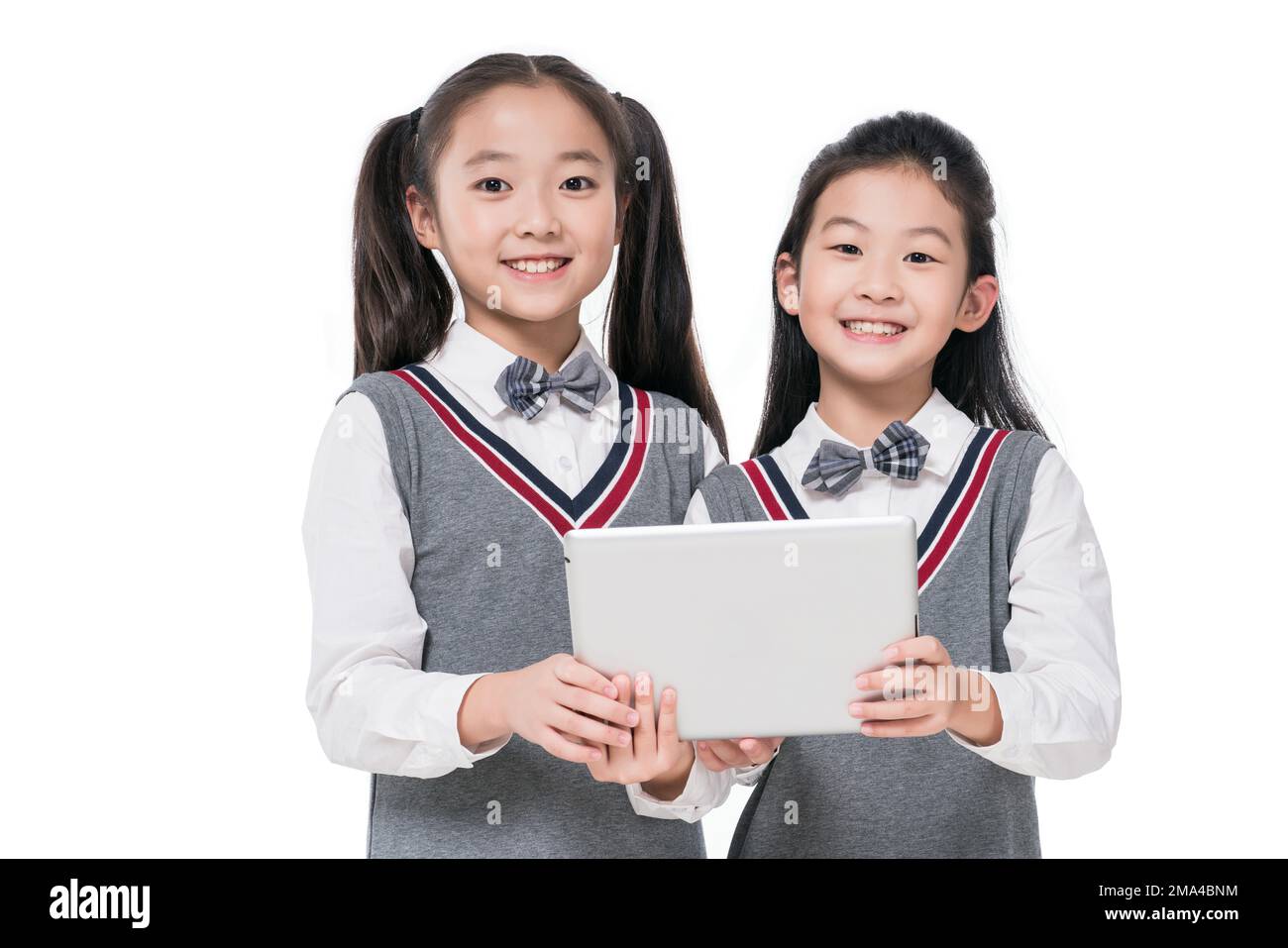 Happy pupils took the tablet Stock Photo - Alamy