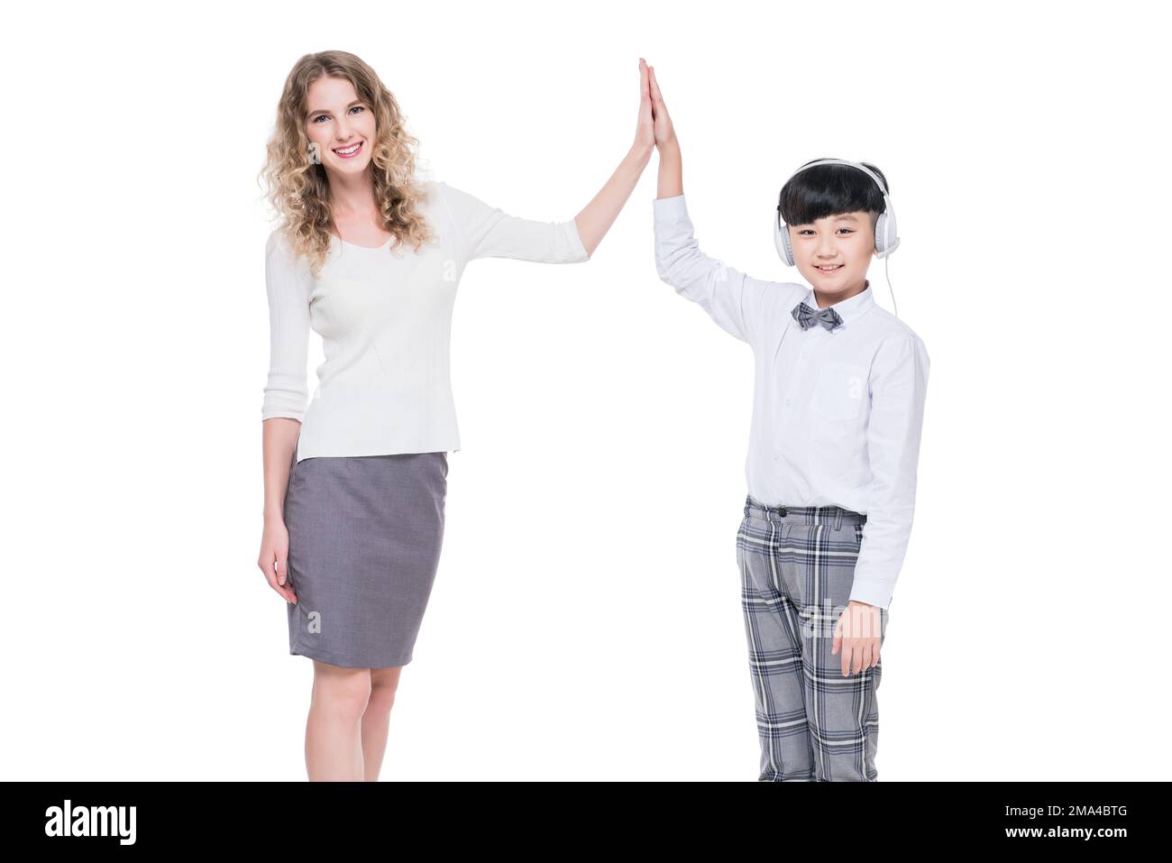 Female teachers and pupils hand-clapping Stock Photo - Alamy
