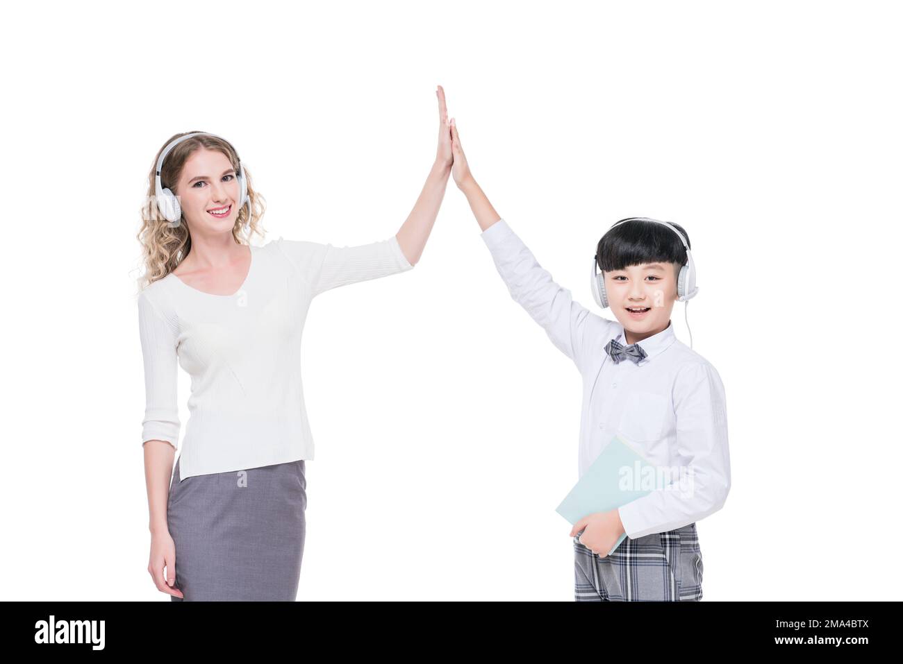 Female teachers and pupils hand-clapping Stock Photo - Alamy