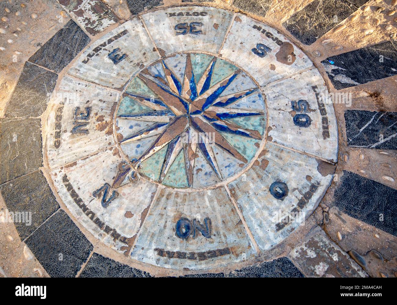 Old compass painted on the ground at the top of the village of Altea in ...