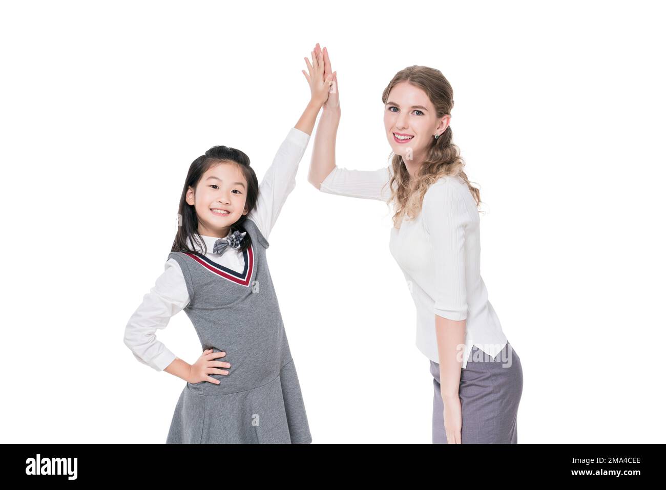 Female teachers and pupils hand-clapping Stock Photo - Alamy