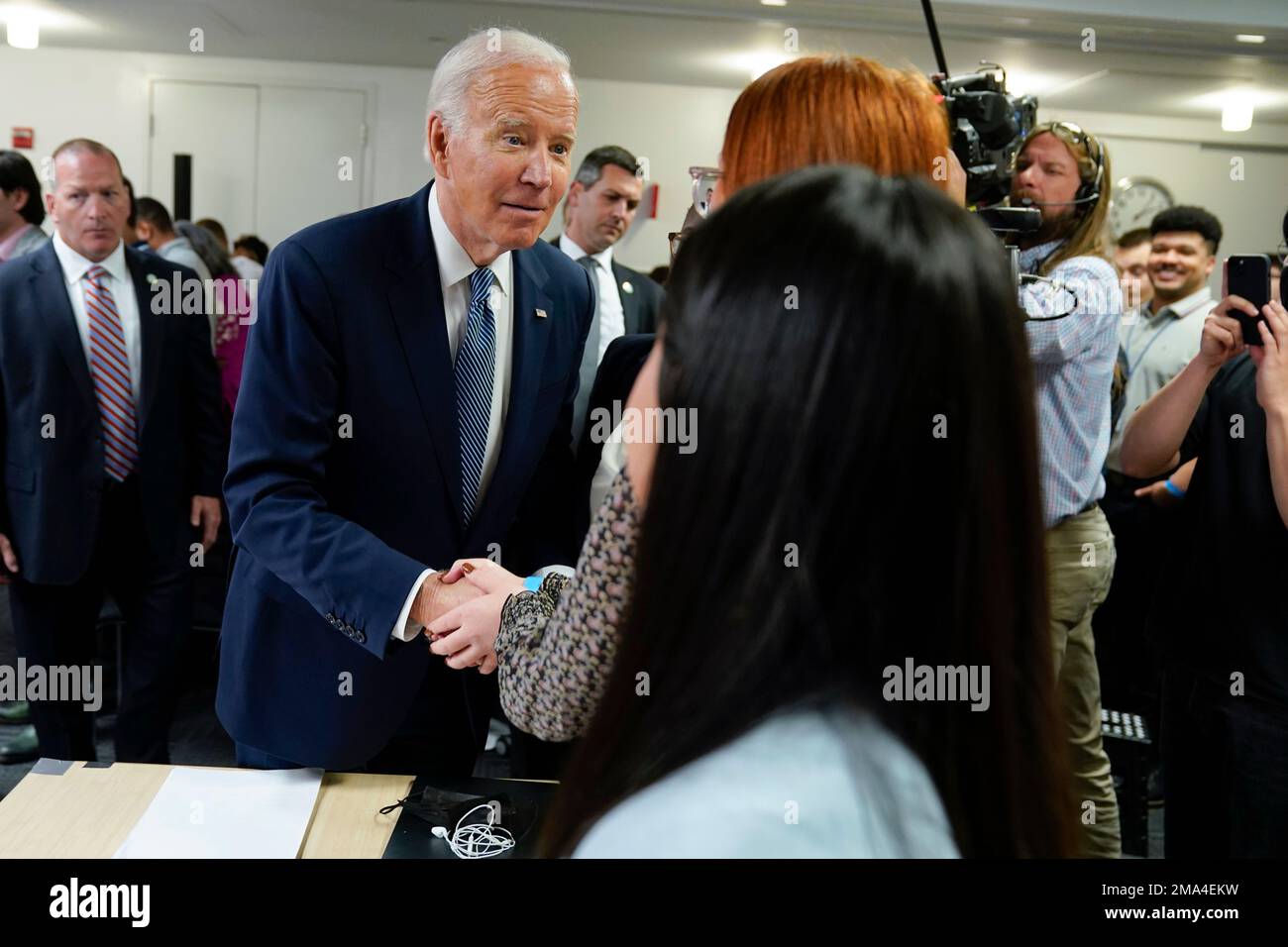 President Joe Biden greets people after speaking during a visit to the ...