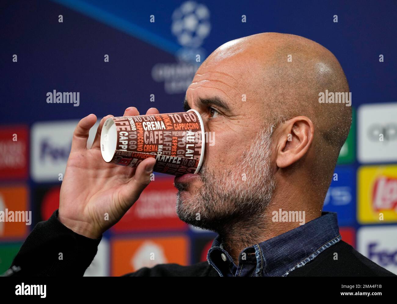 Manchester City's head coach Pep Guardiola drinks a coffee at a press ...