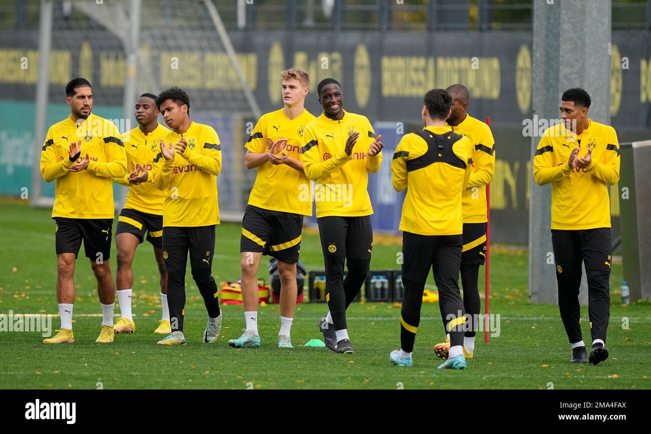 Dortmund's Jude Bellingham, right, and his team clap hands during the ...