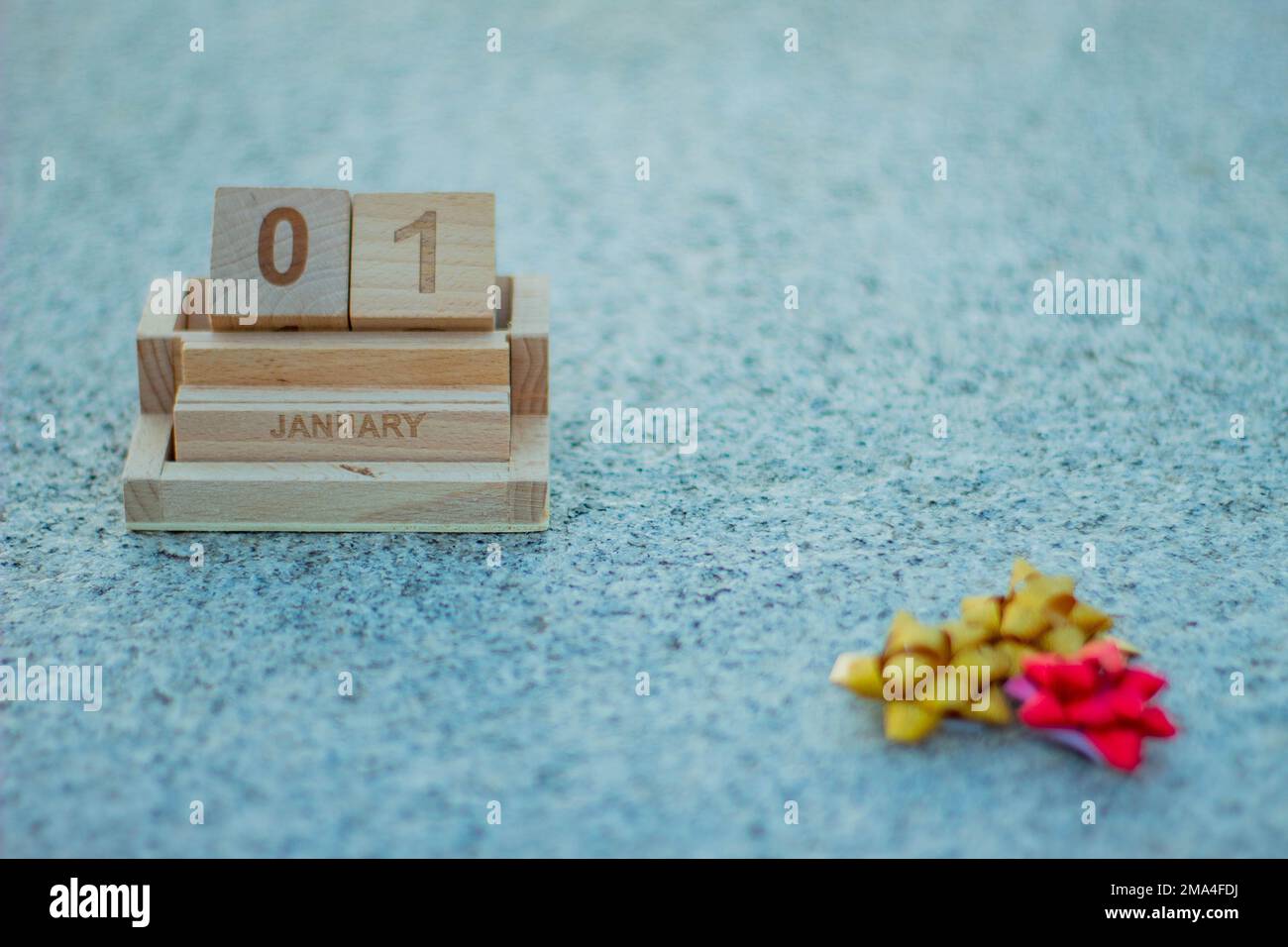 Wooden calendar with numbers of days in cubes and cards with the months ...