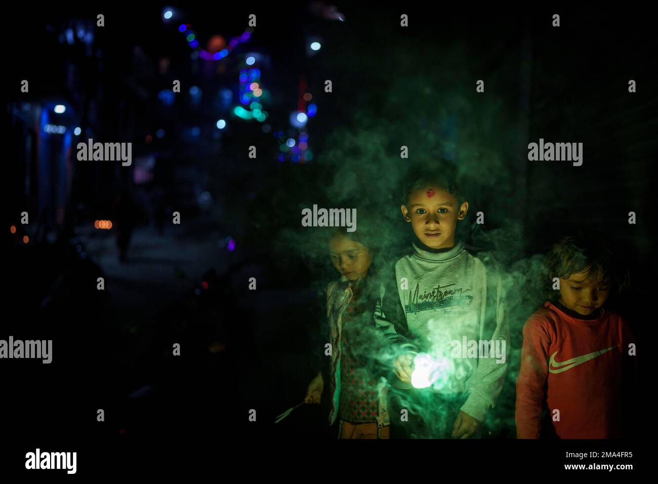 Children light firecrackers during Tihar festival in Kathmandu, Nepal ...