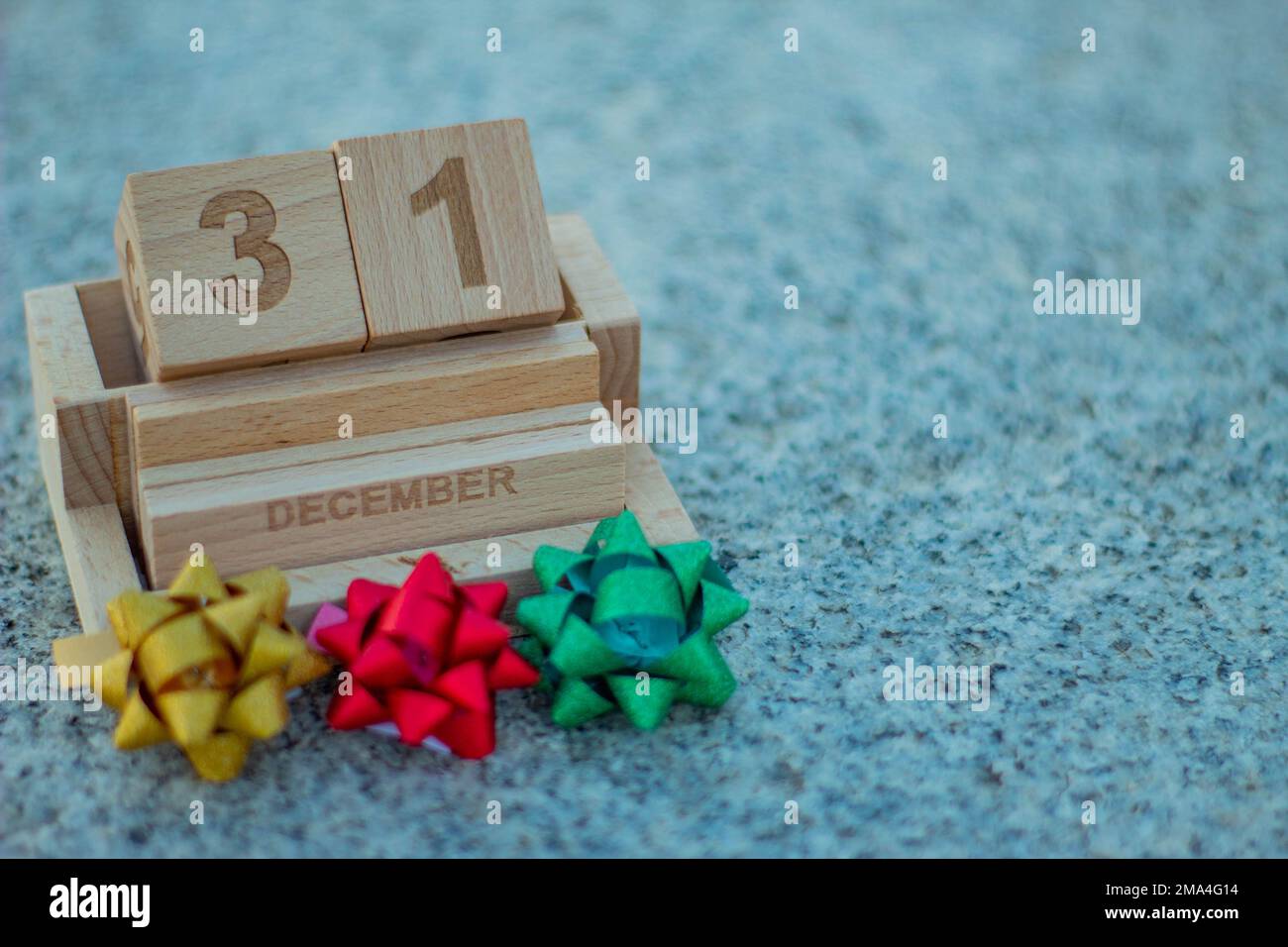 Recycled wooden calendar with the date of December 31, New Year's Eve ...