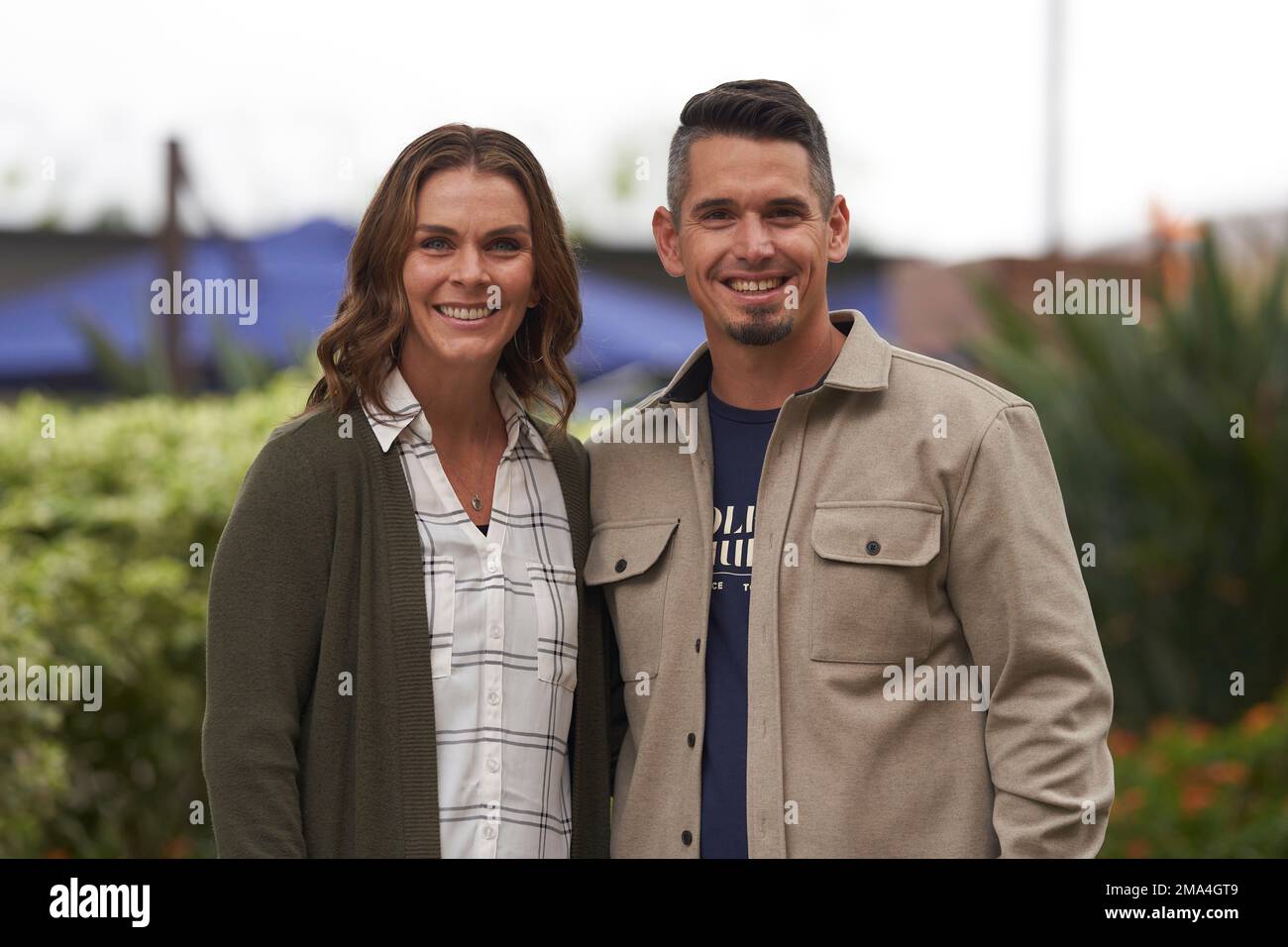 Pastor Andy Wood and his wife, Stacie Wood, stand for a portrait on ...