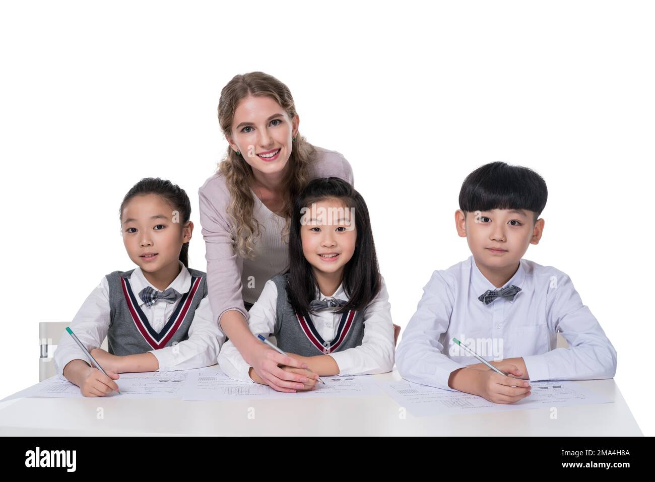 Female teachers guide students learning Stock Photo - Alamy