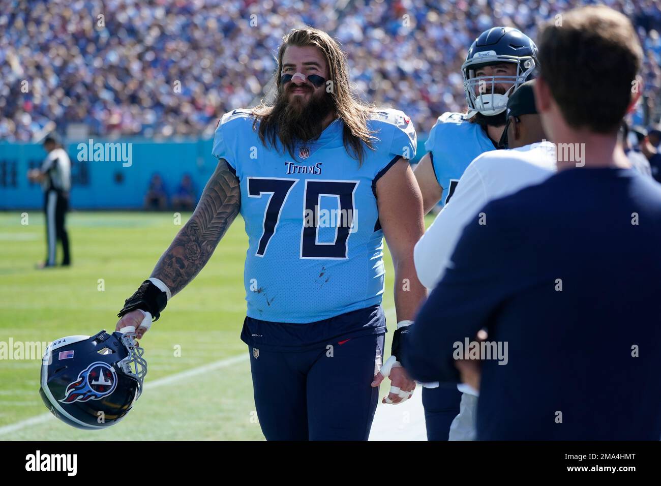 Tennessee Titans guard Jordan Roos (70) walks on the sideline in the ...