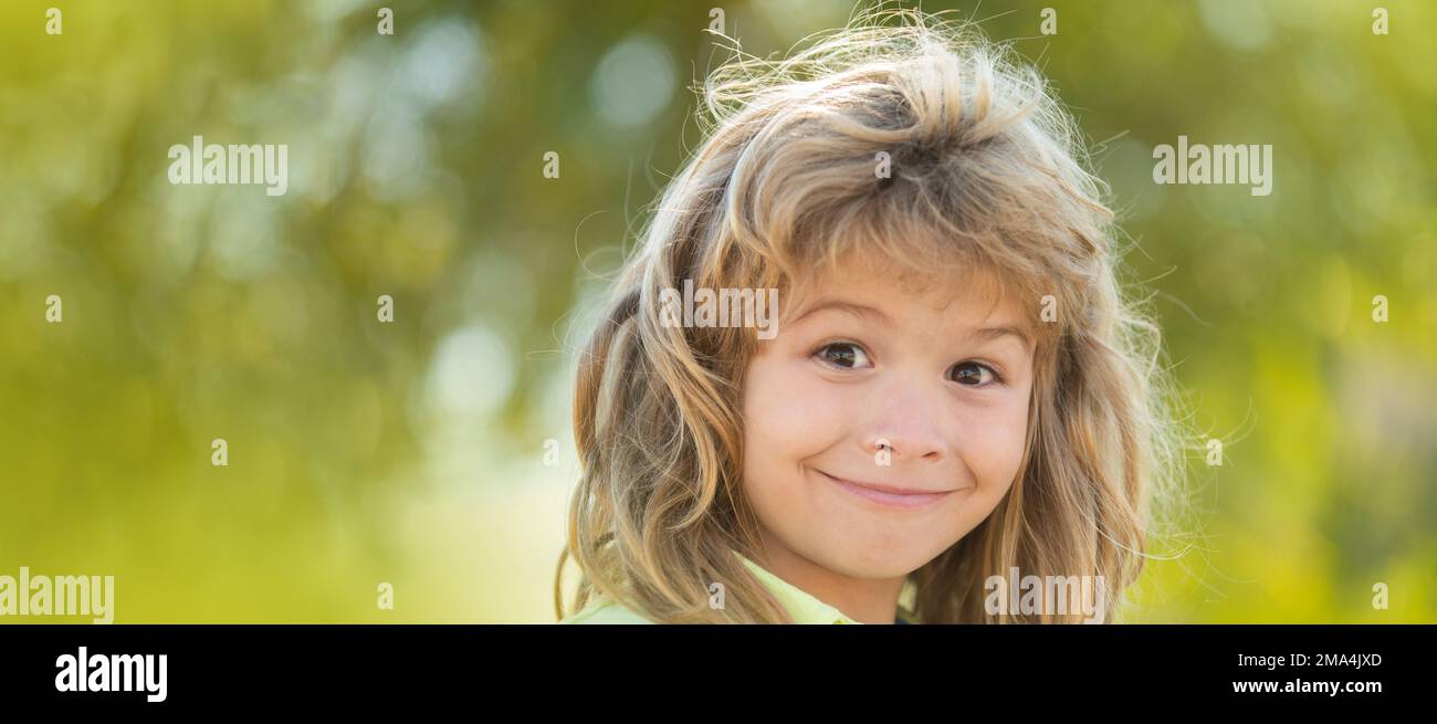 Close up face of cute child outdoors. Spring banner for website header ...