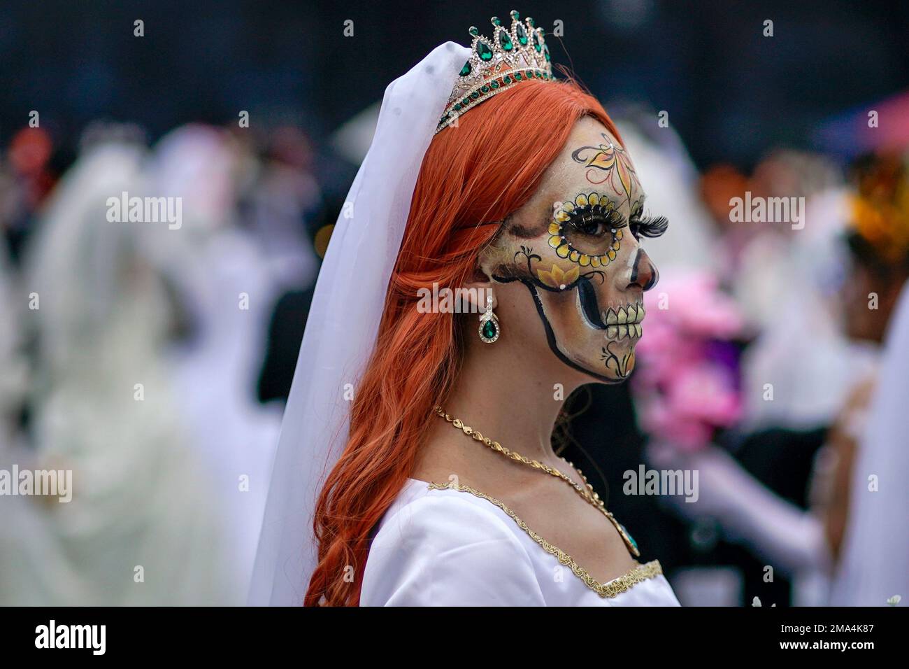 A woman dressed as an iconic Mexican "Catrina" takes part in the Grand ...