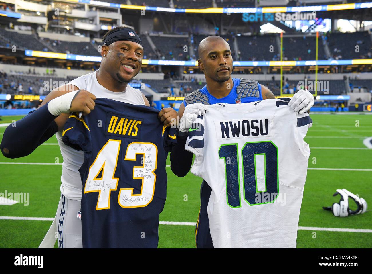 Seattle Seahawks linebacker Uchenna Nwosu, left, and Los Angeles ...