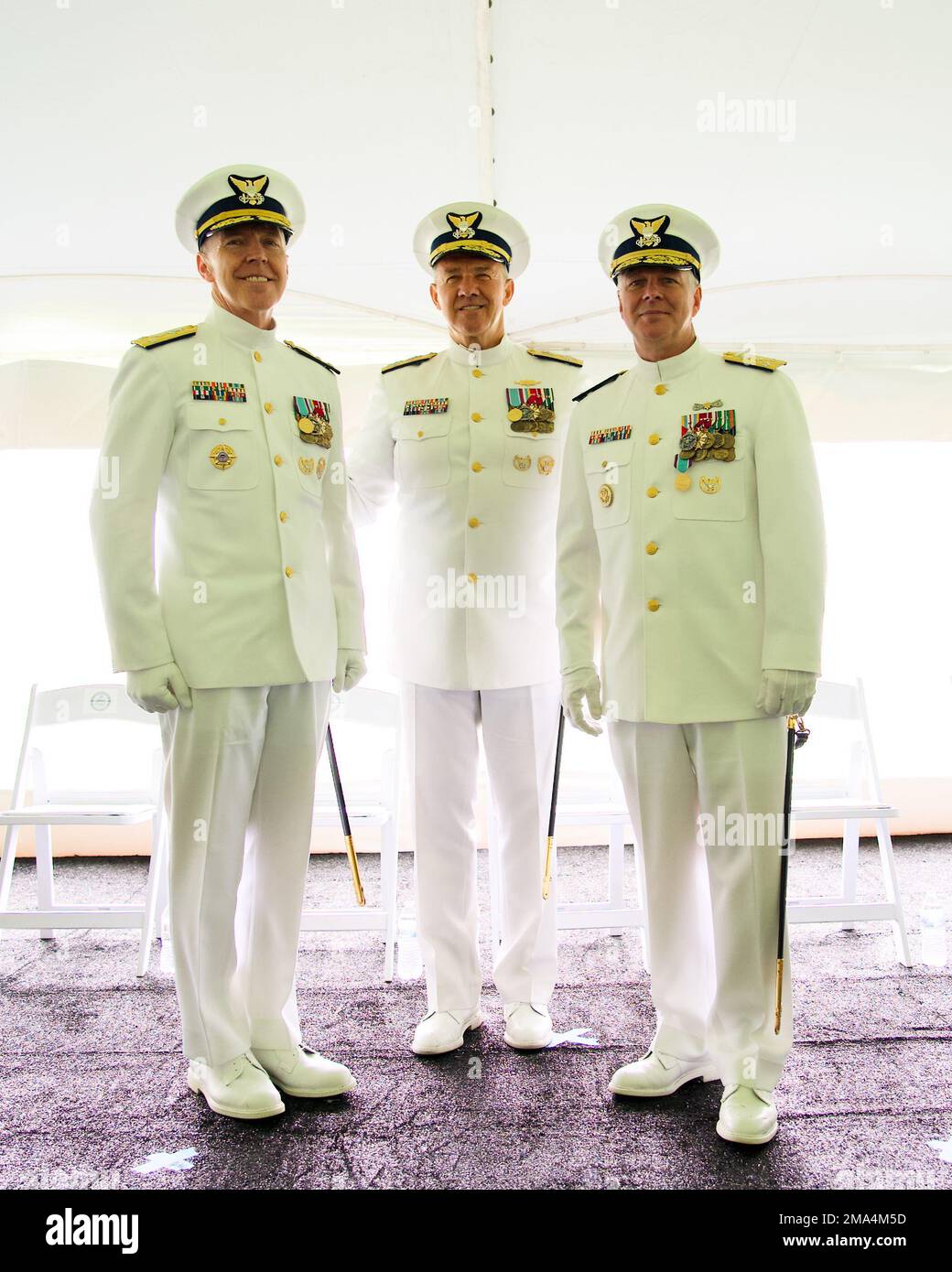 Vice Adm. Kevin Lunday stands with Vice Adm. Steven Poulin as he takes command of the U.S. Coast ...