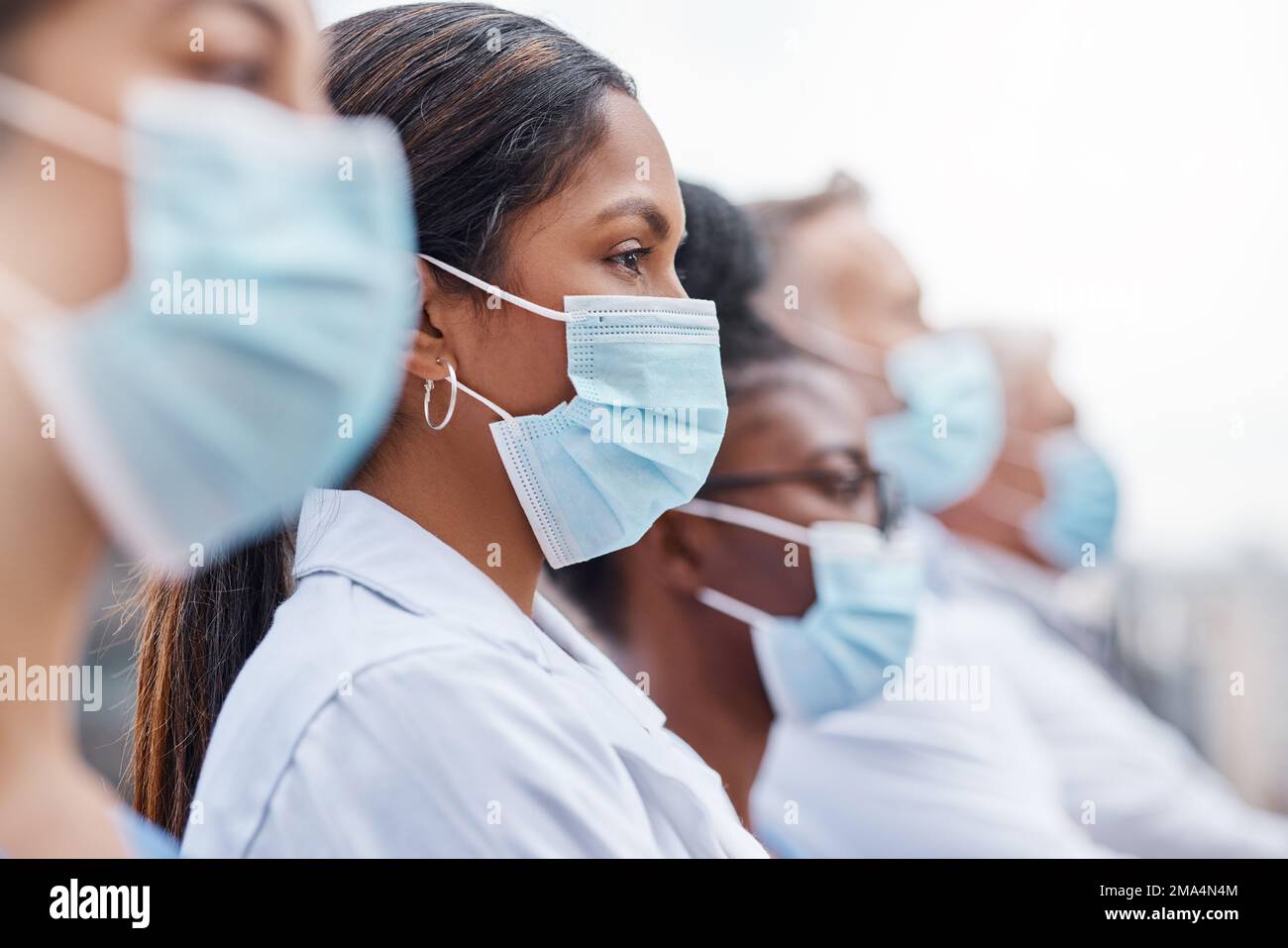 Its not easy being a frontline worker. Closeup shot of a group of ...